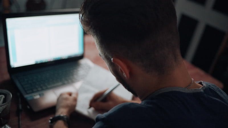 Man, Writing, Book, Laptop by Dmitrii Borovikov – Stock Footage | Artlist