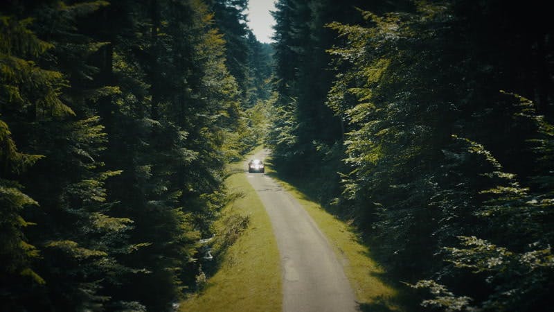 Drone, Red Car, Driving, Trees by Max Freyss – Stock Footage | Artlist