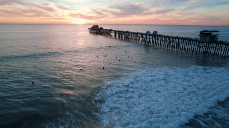 Surfers, Jetty, Dock, Waves by David Zalka – Stock Footage | Artlist