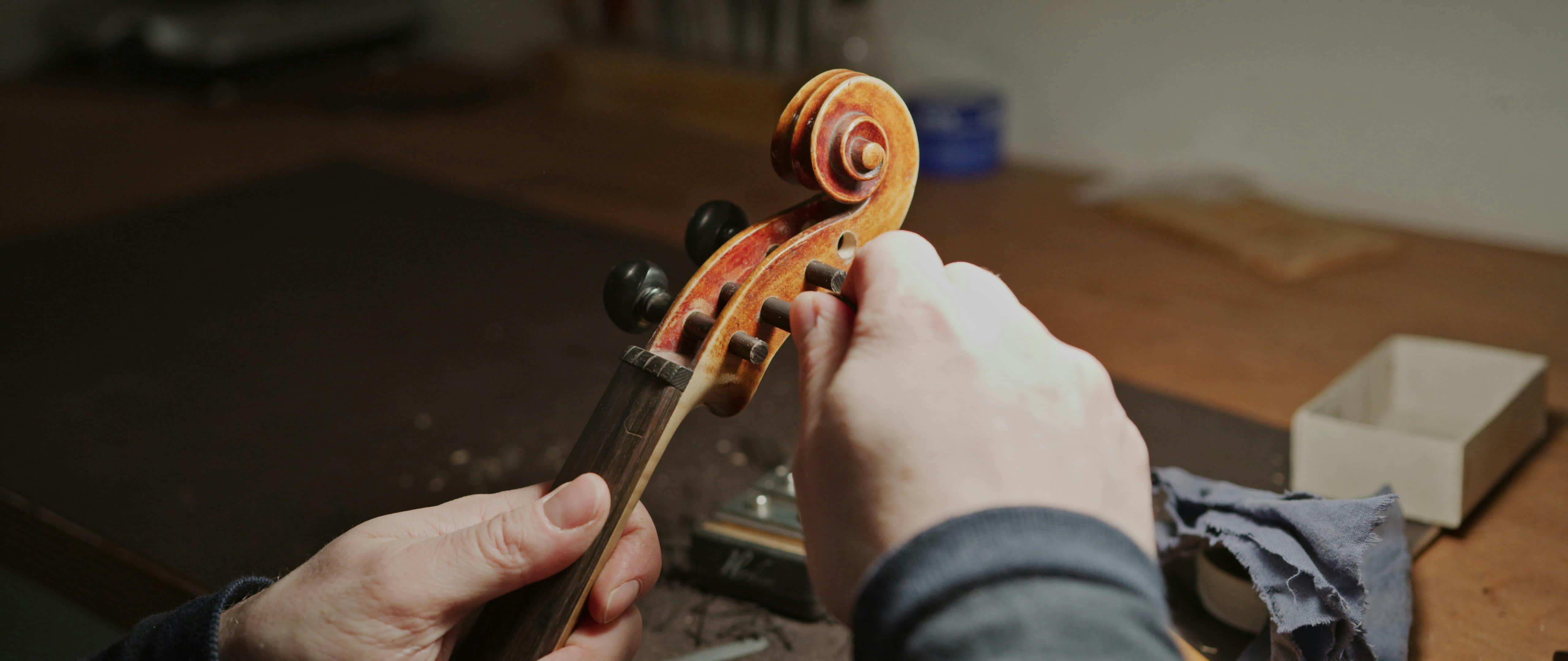 Discover violin-maker-working-on-violin-scroll, a story-driven footage ...