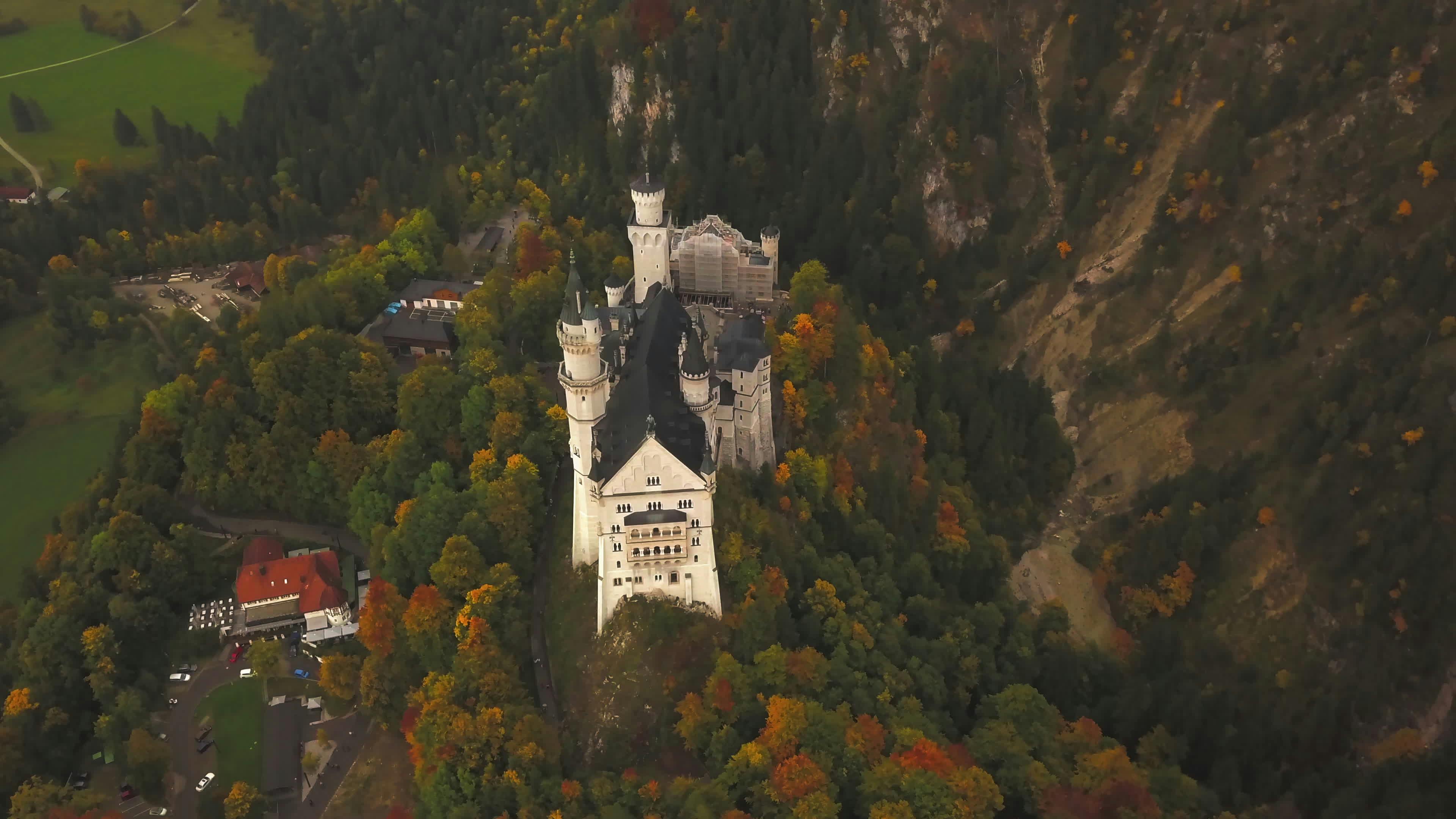 Discover schloss-neuschwanstein-in-the-autumn-aerial, a story-driven ...