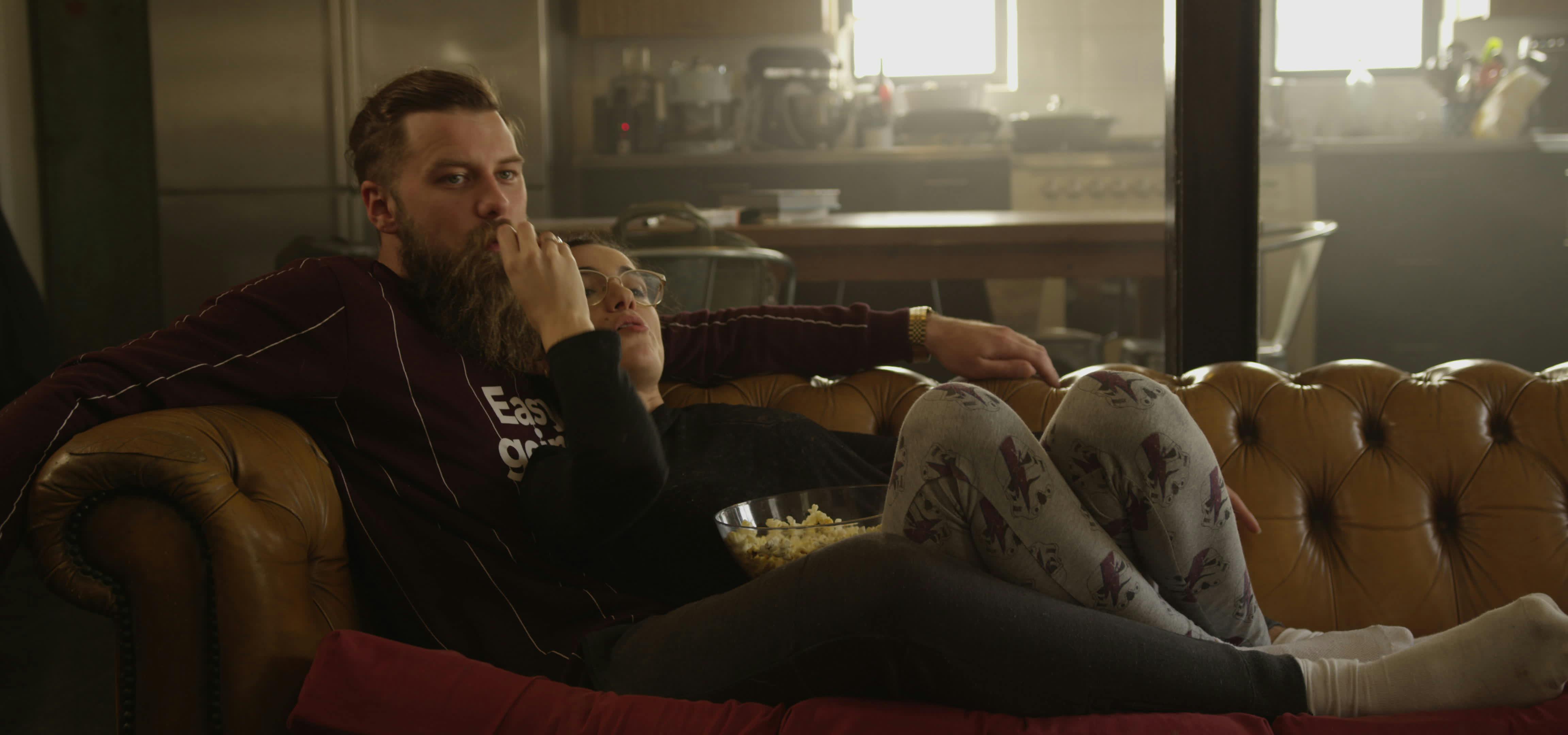 Discover couple-watching-a-movie-on-the-couch, a story-driven footage ...